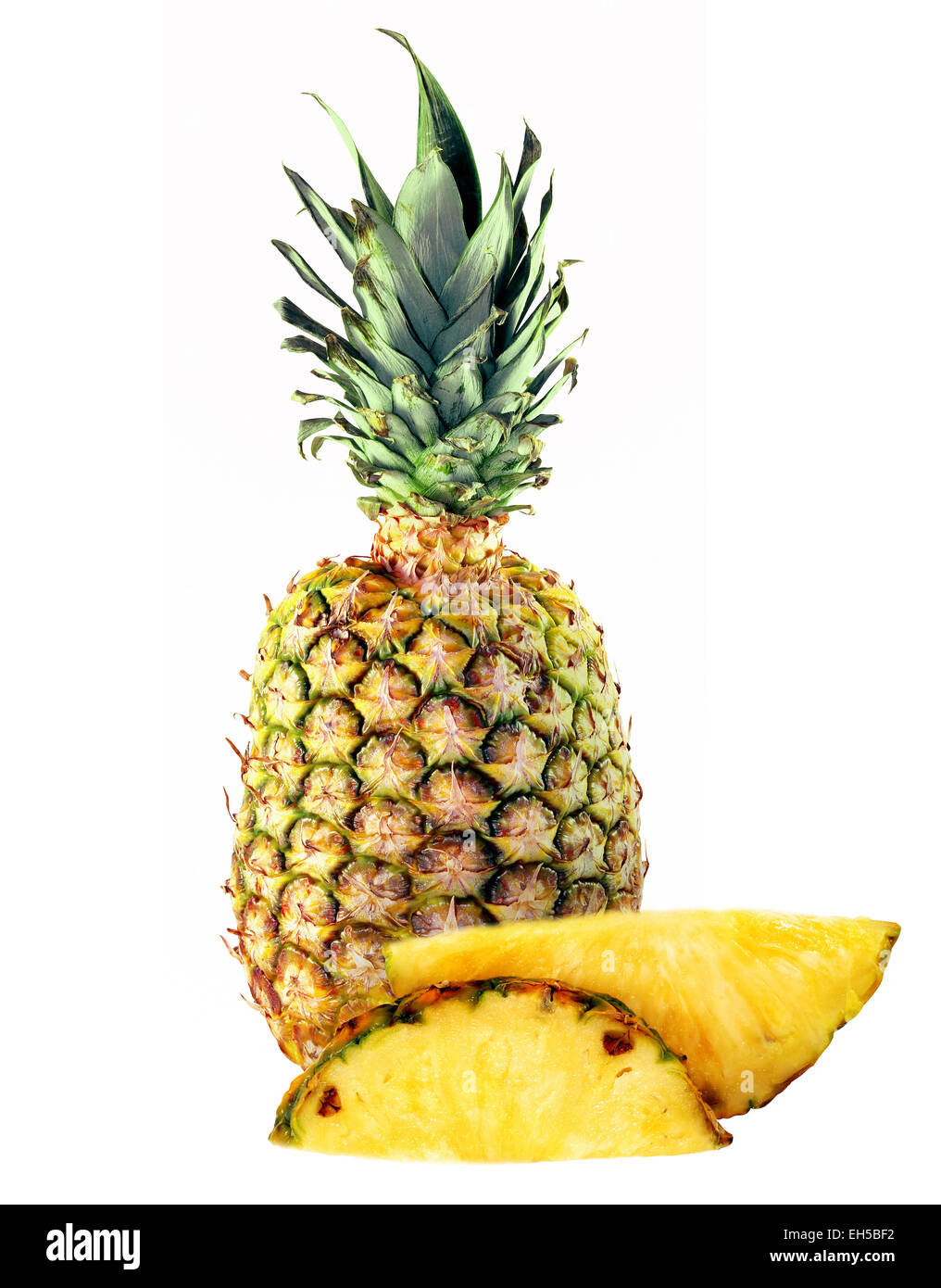 bright beautiful pineapple and slices on a white background Stock Photo ...