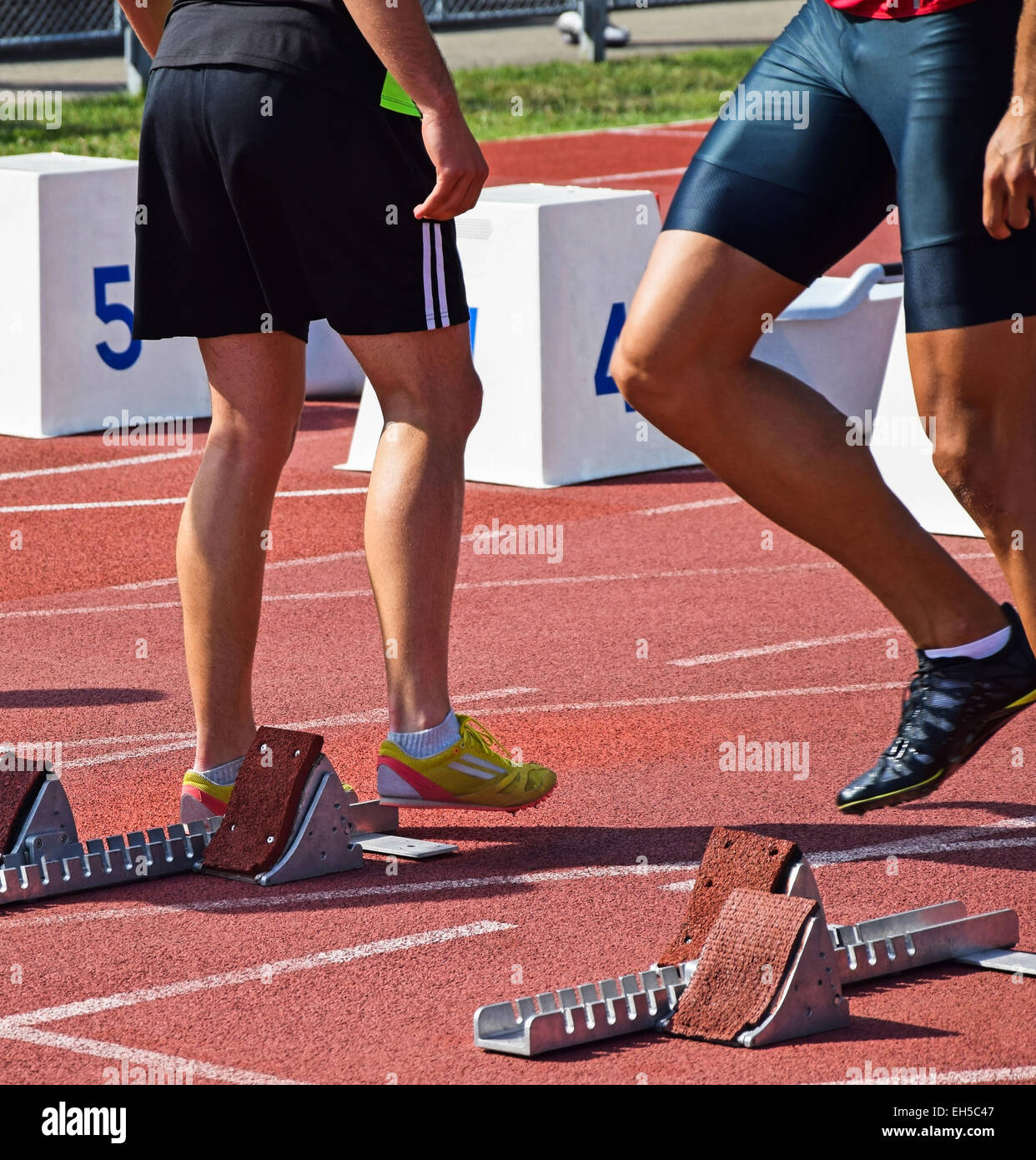 Two runners at the starting line Stock Photo - Alamy