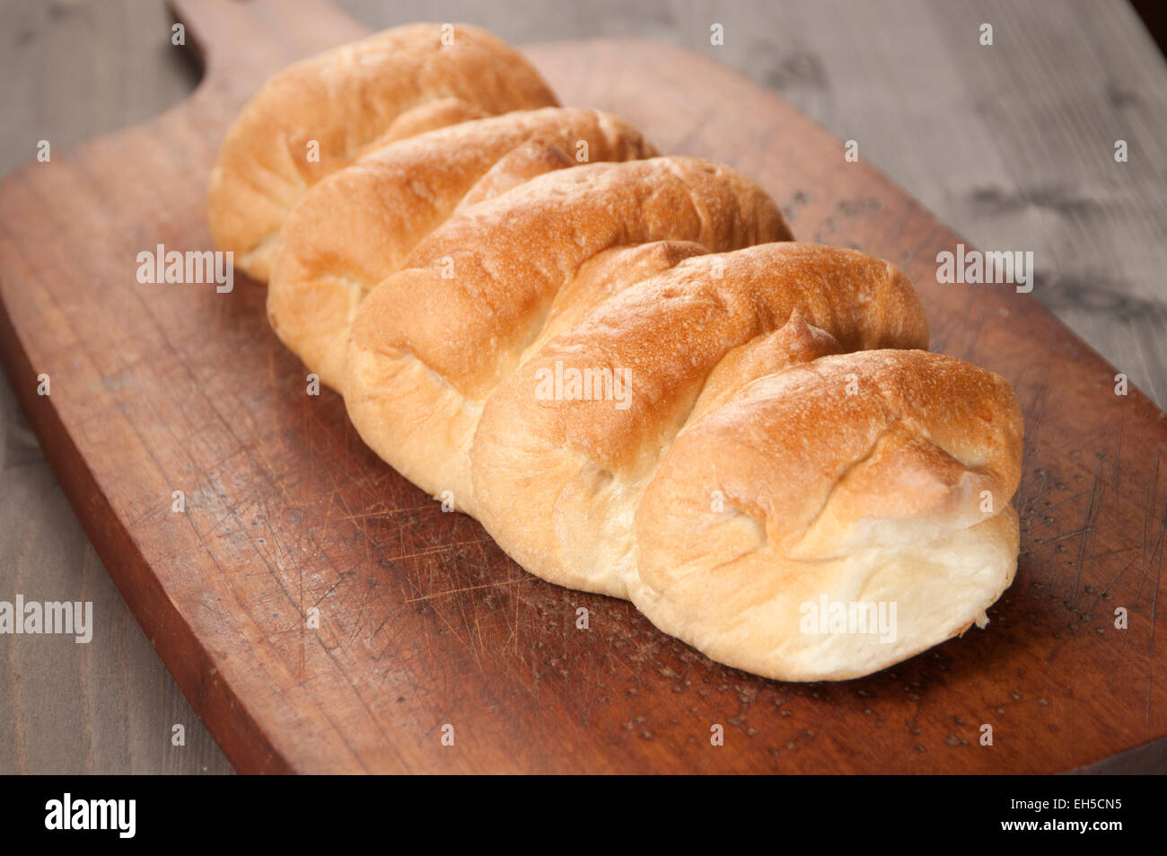 Traditional wheat bread on a timber board Stock Photo - Alamy