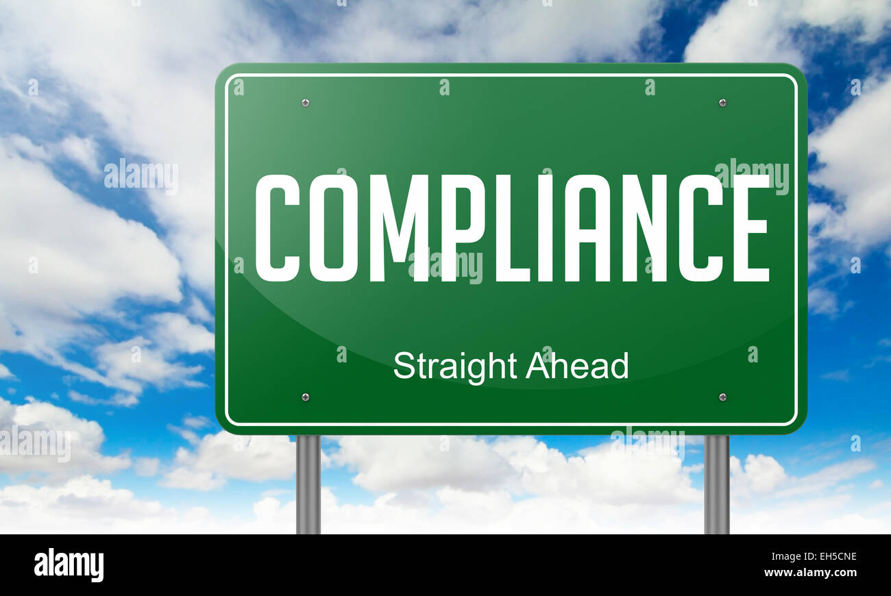 Highway Signpost with Compliance wording on Sky Background Stock Photo ...