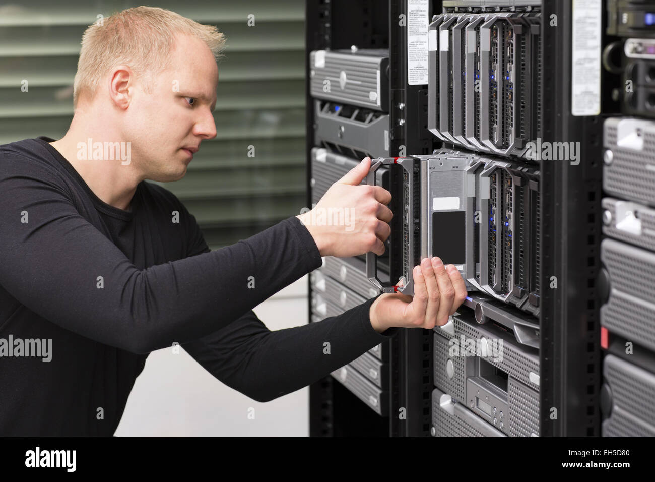 Technician install network rack in hi-res stock photography and images ...