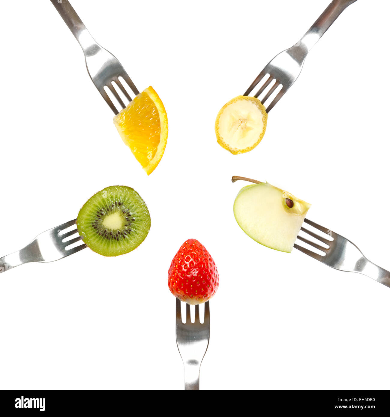Fresh organic fruit on forks on white background. High resolution image ...