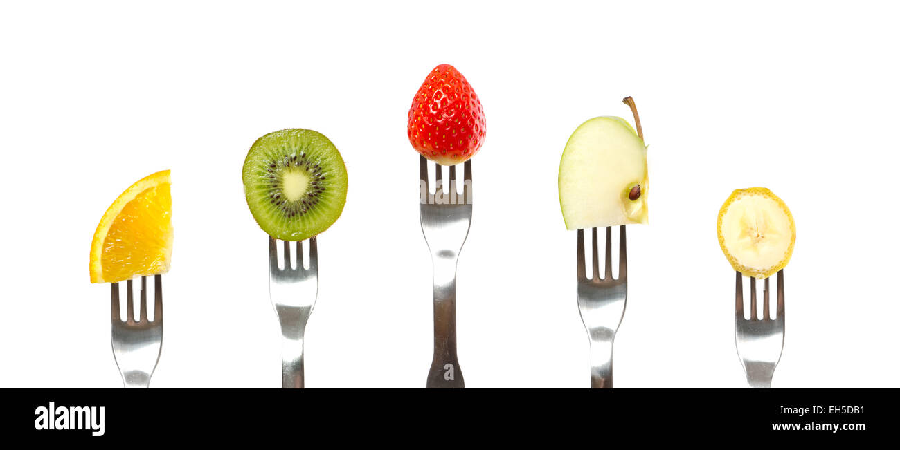 Fresh organic fruit on forks on white background. High resolution image ...