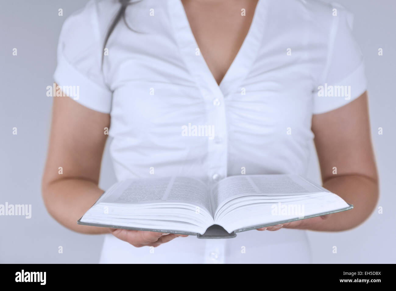 Woman holding bible hi-res stock photography and images - Alamy