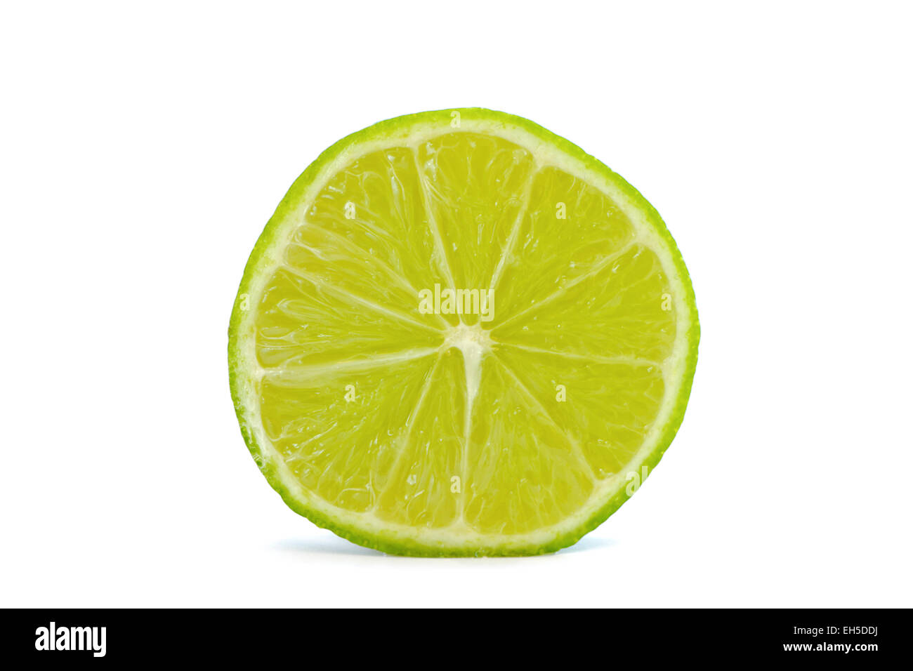 Side view of a fresh divided organic lime on white background Stock ...
