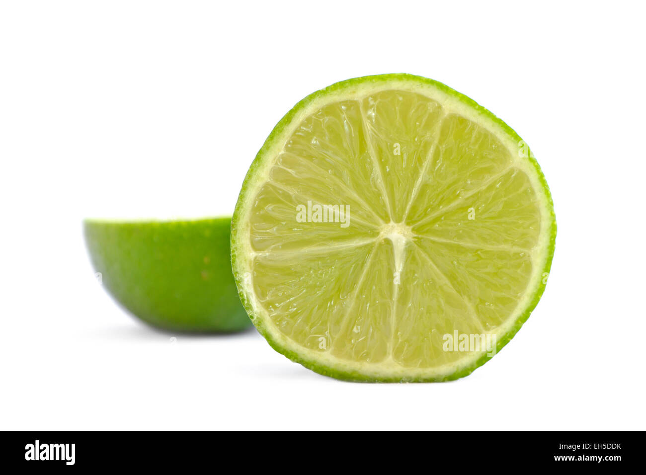 Side view of a fresh sliced organic lime on white background Stock ...