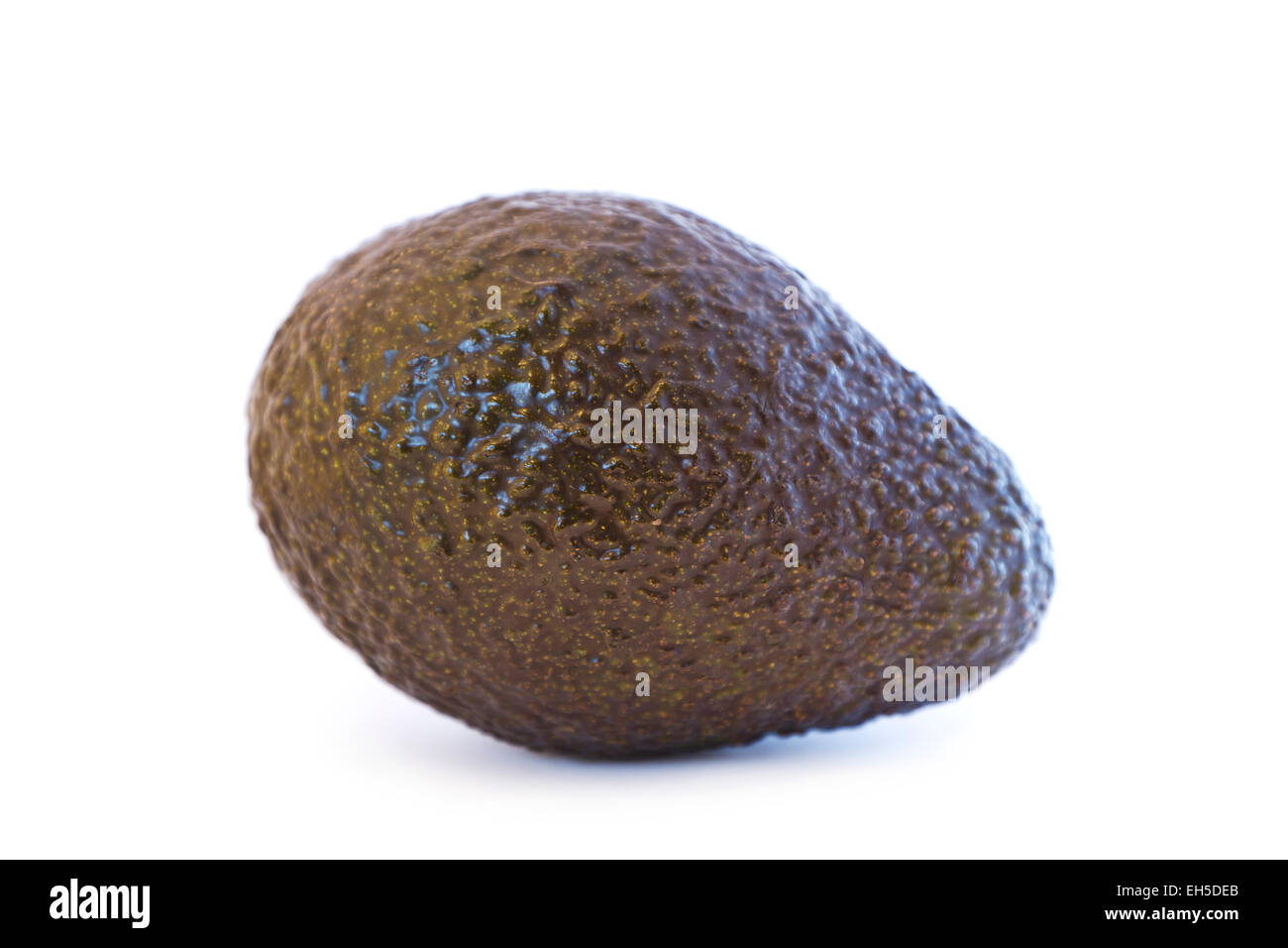 Side view of a organic avocado on white background Stock Photo - Alamy