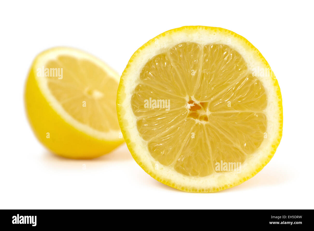 Side view of a fresh sliced organic lemon white background Stock Photo ...