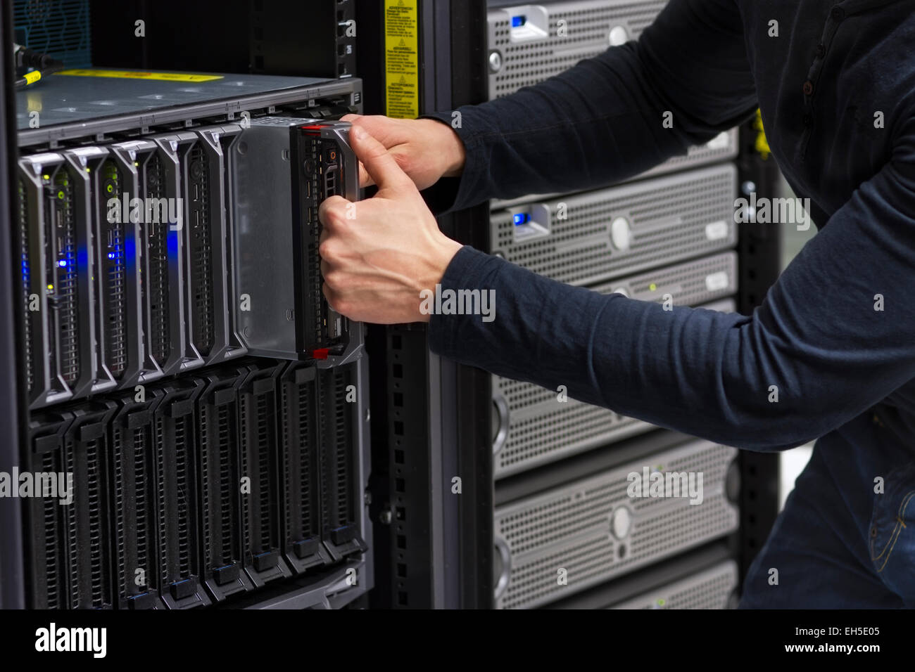 Install or remove a blade server in a blade chassis in a rack. Shot in ...