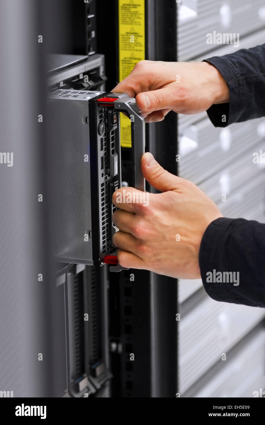 Install or remove a blade server in a blade chassis in a rack. Shot in ...