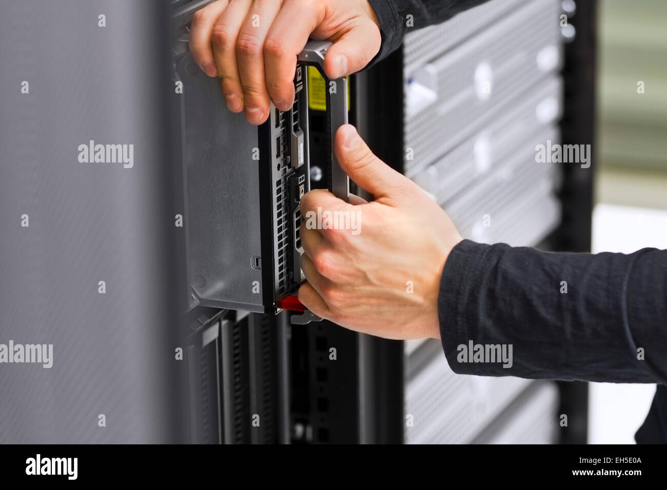 Install or remove a blade server in a blade chassis in a rack. Shot in ...