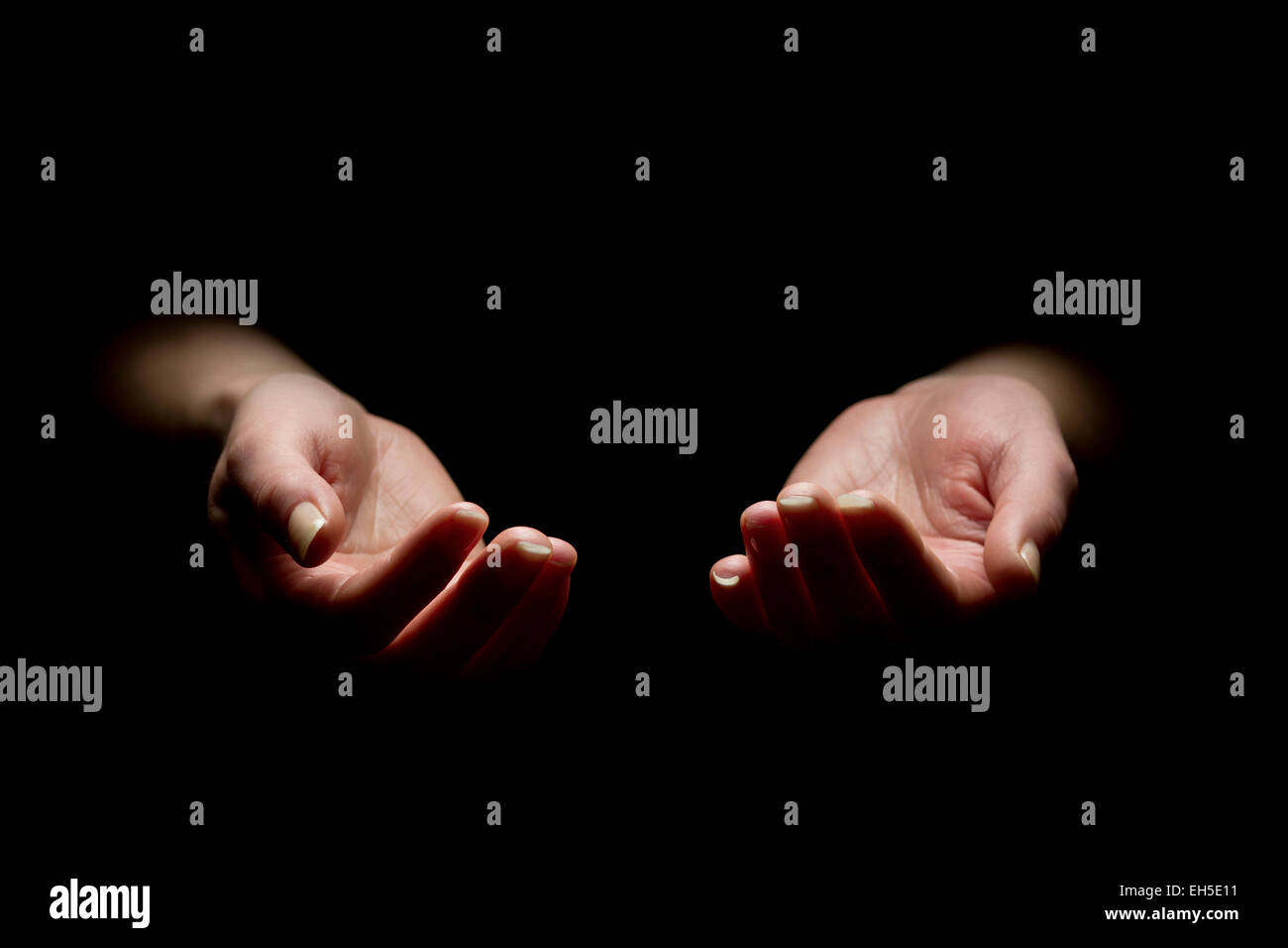Woman begging with outstretched hands. Hands reaching out. Black and ...