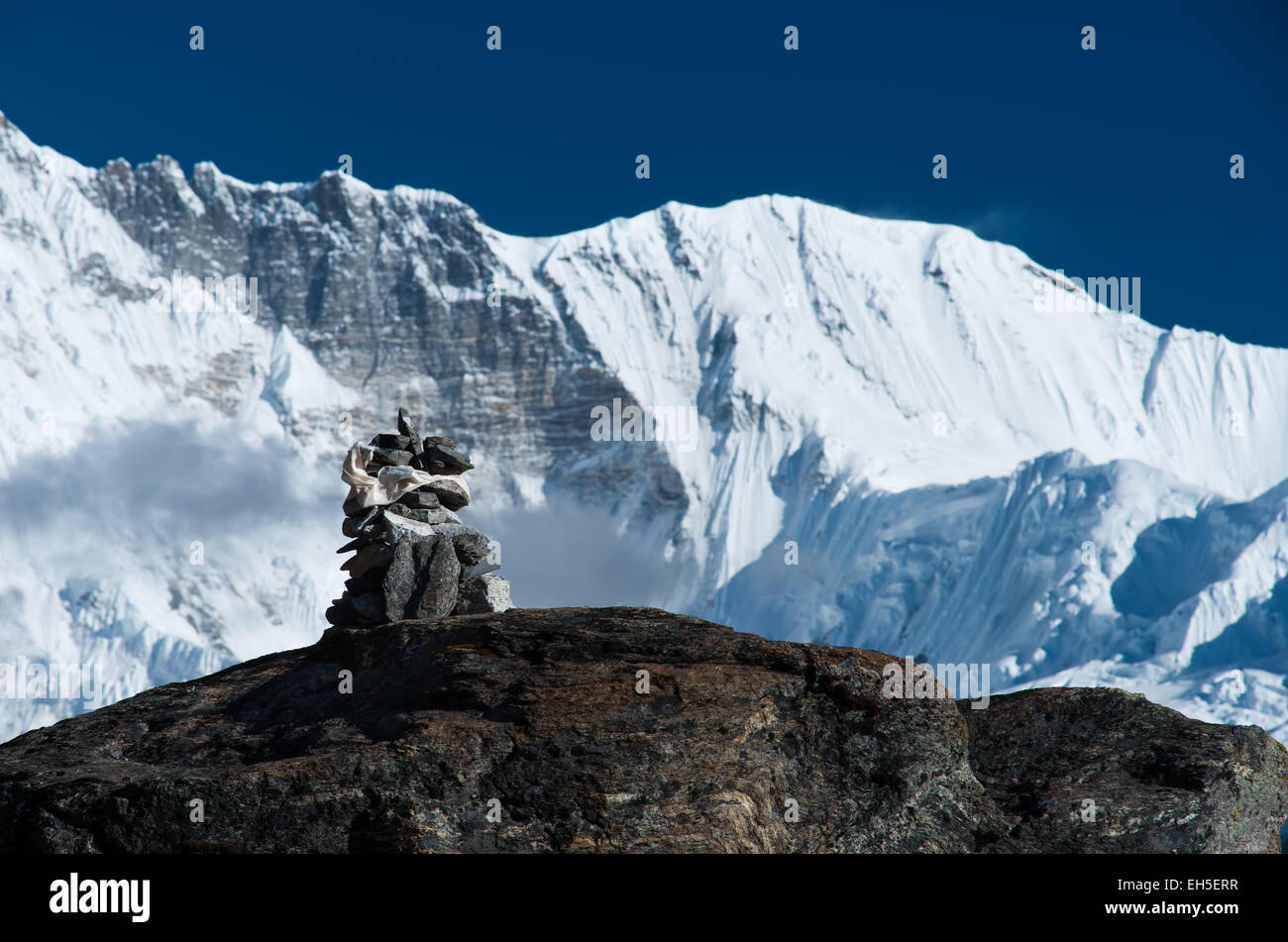 Harmony: Stone stack and mountain range in Himalayas. Gokyo, Nepal ...