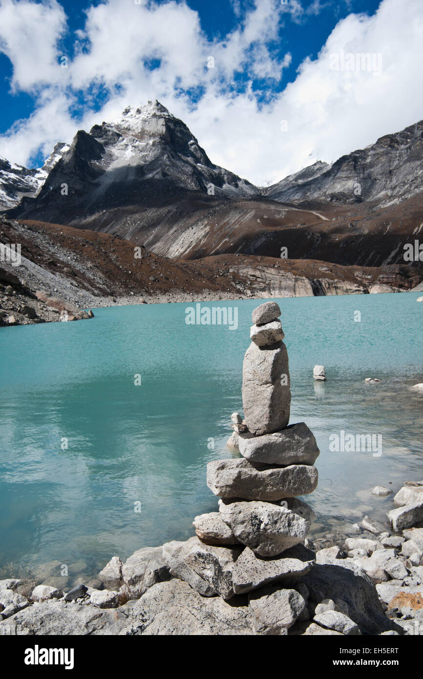 Harmony: Stone stack and Sacred Lake near Gokyo. Travel to Nepal Stock ...