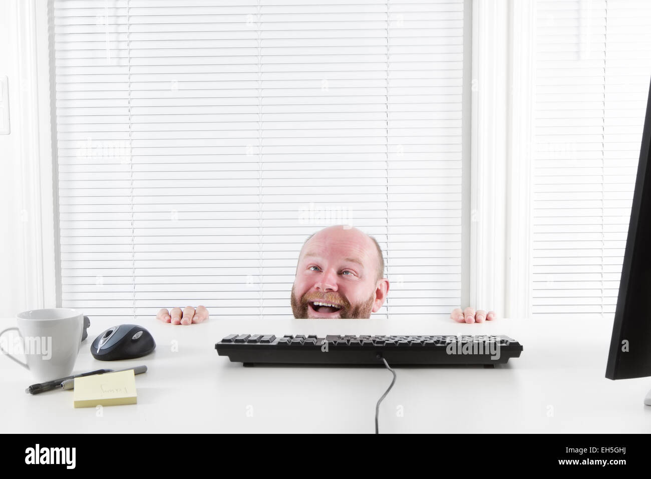 Hiding Under Desk High Resolution Stock Photography and Images - Alamy