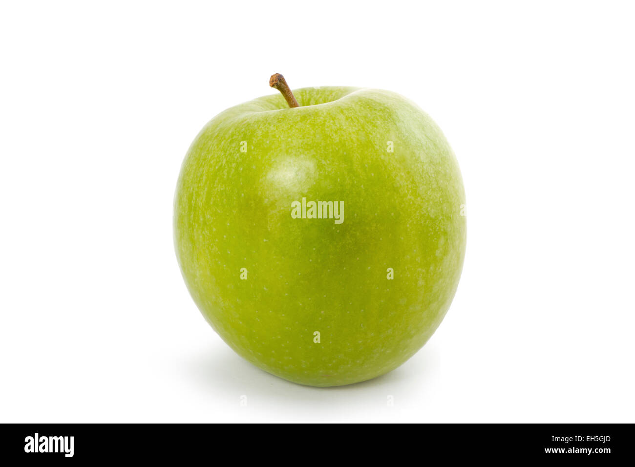 Side view of a fresh organic green apple on white background Stock ...
