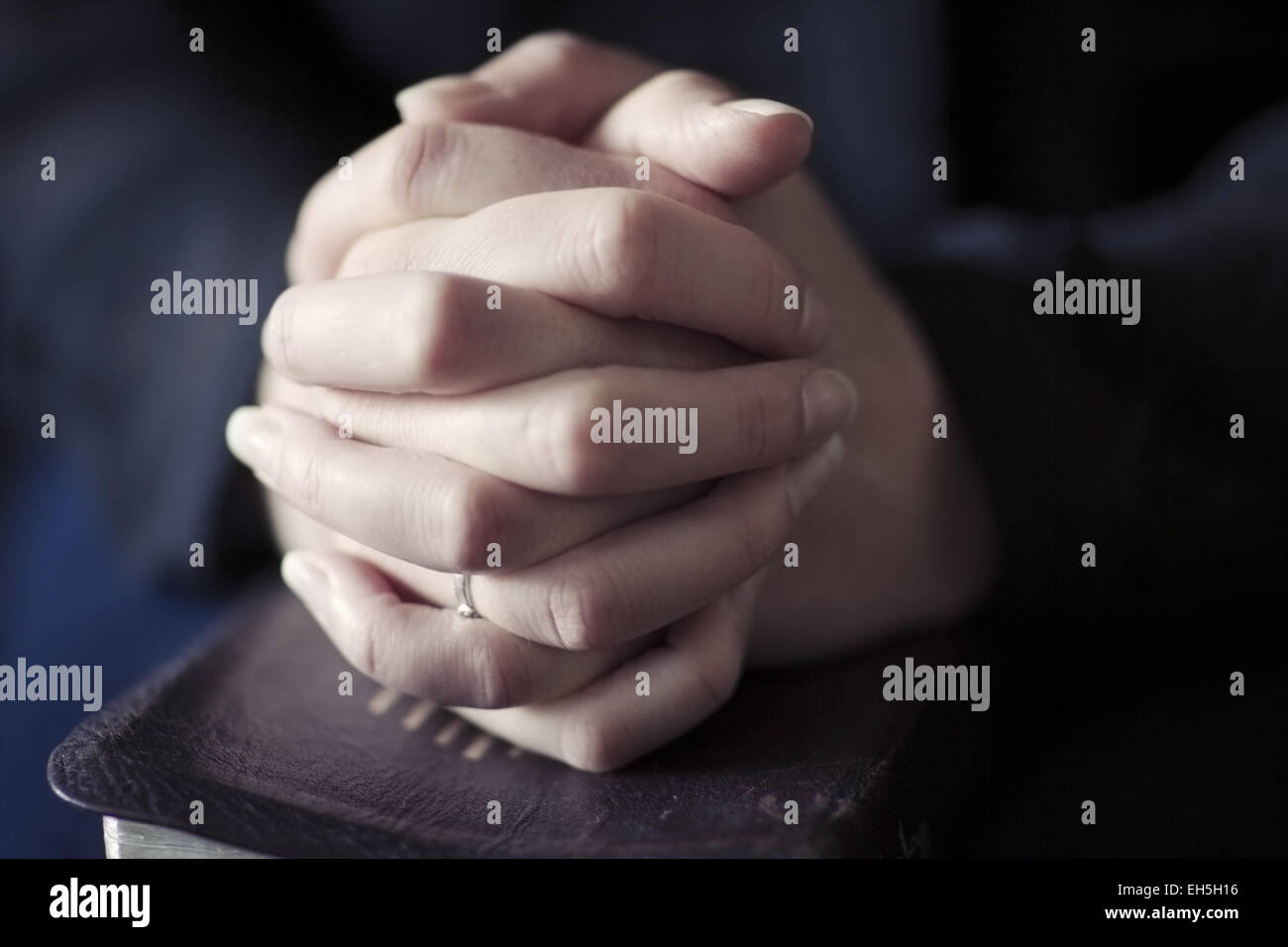 Hand on a bible hi-res stock photography and images - Alamy