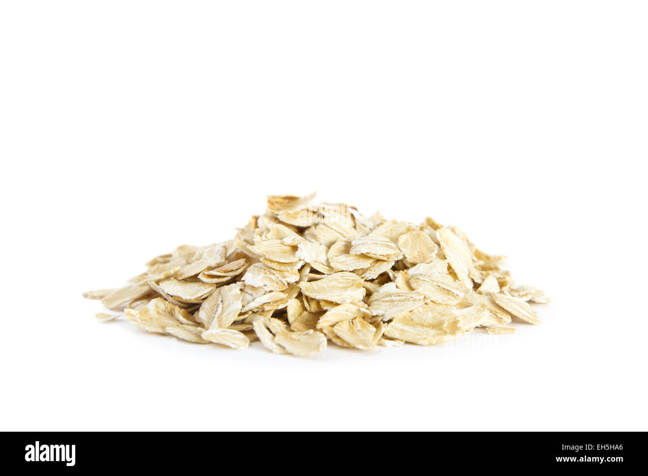 Side view of a pile of raw organic oatmeal on white background Stock ...