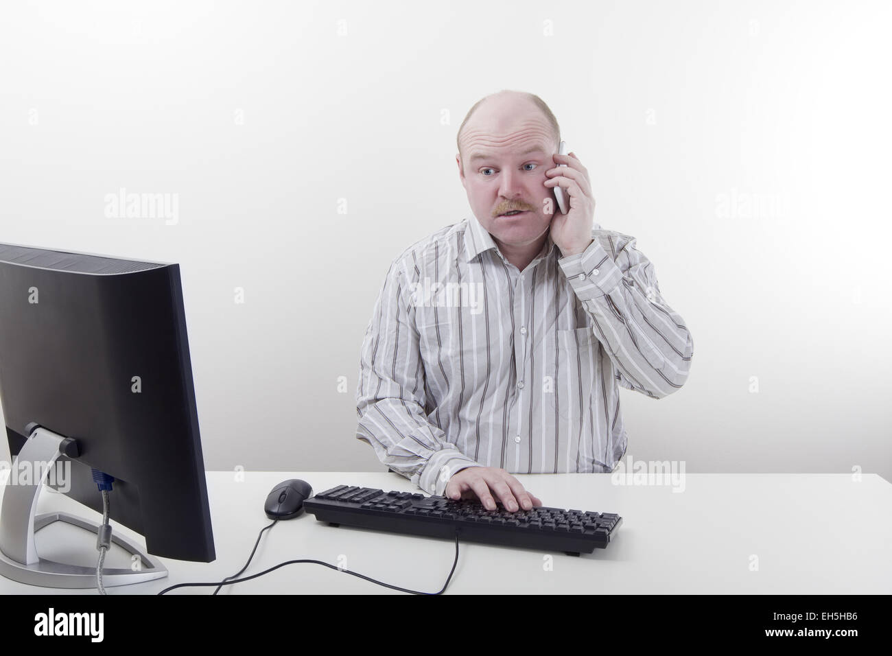 Strange man with problems talks in his mobile / cell phone in his ...