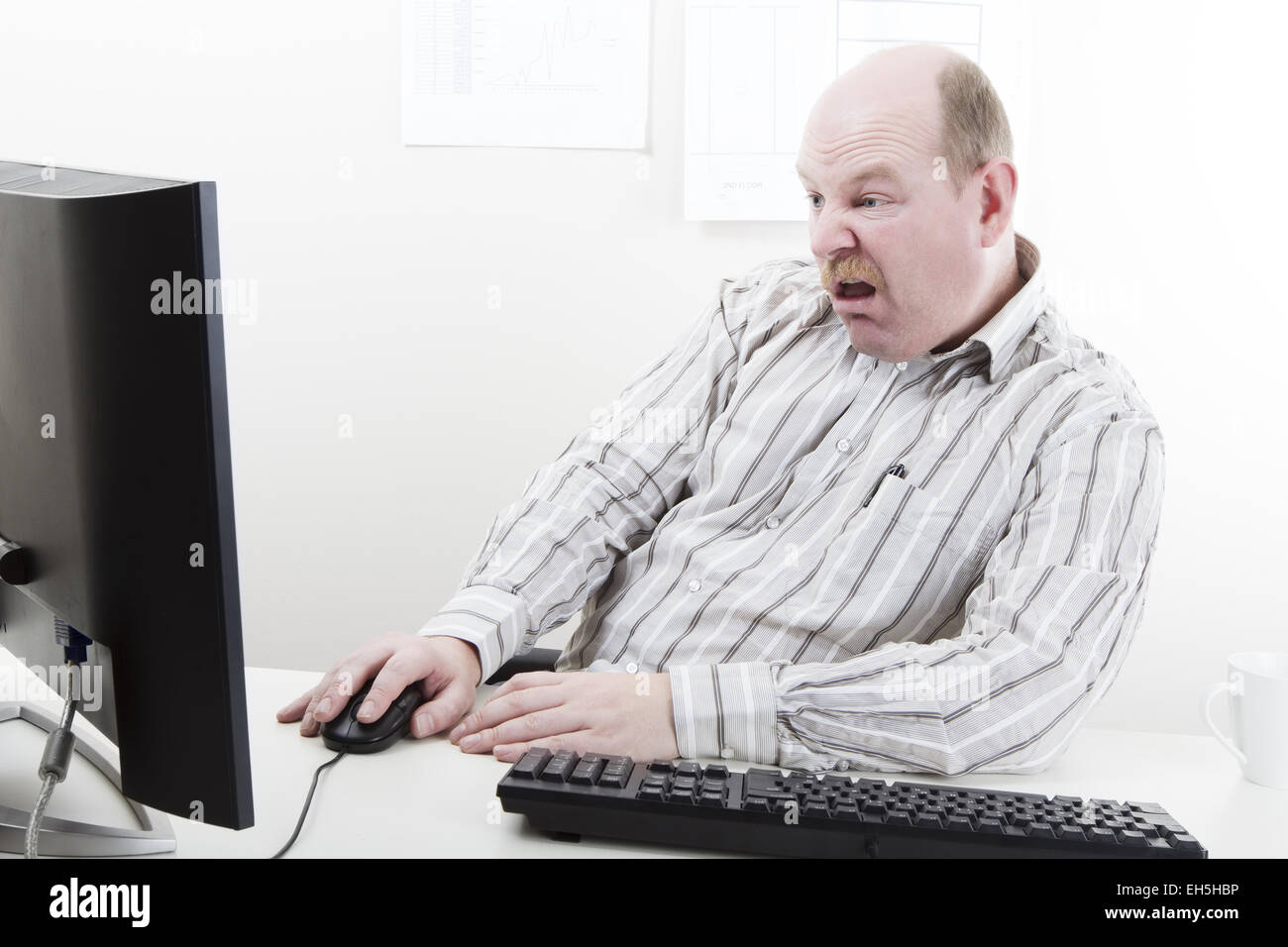 Overworked office worker at his office desk. To much work Stock Photo ...