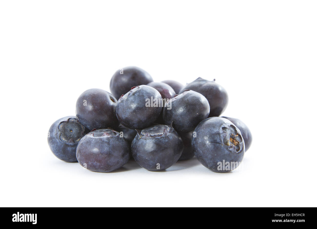 A pile of fresh organic blue berry. Side view on white background Stock ...