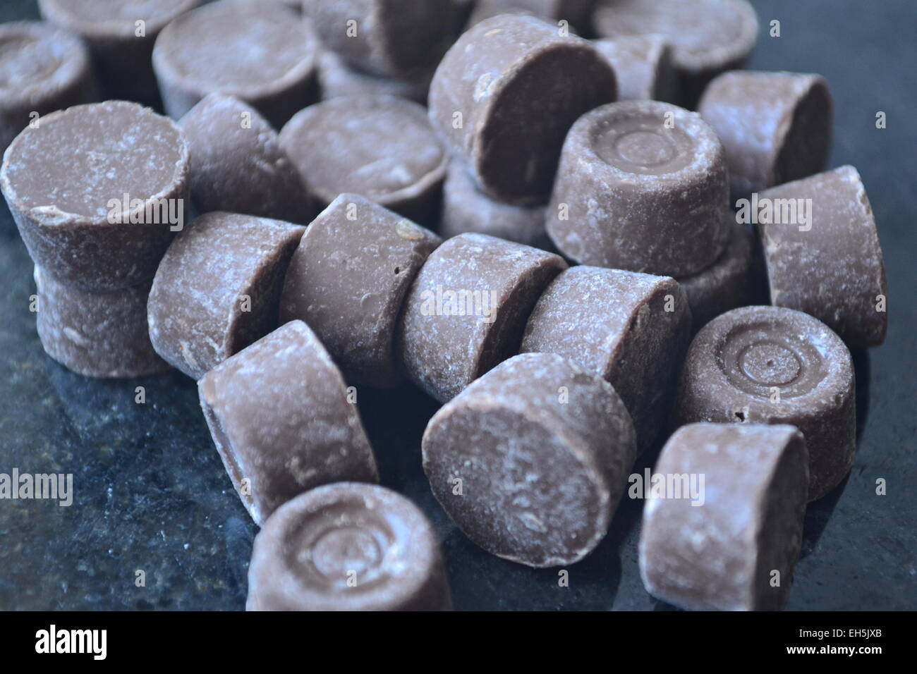 Hand full of Chocolates Stock Photo - Alamy