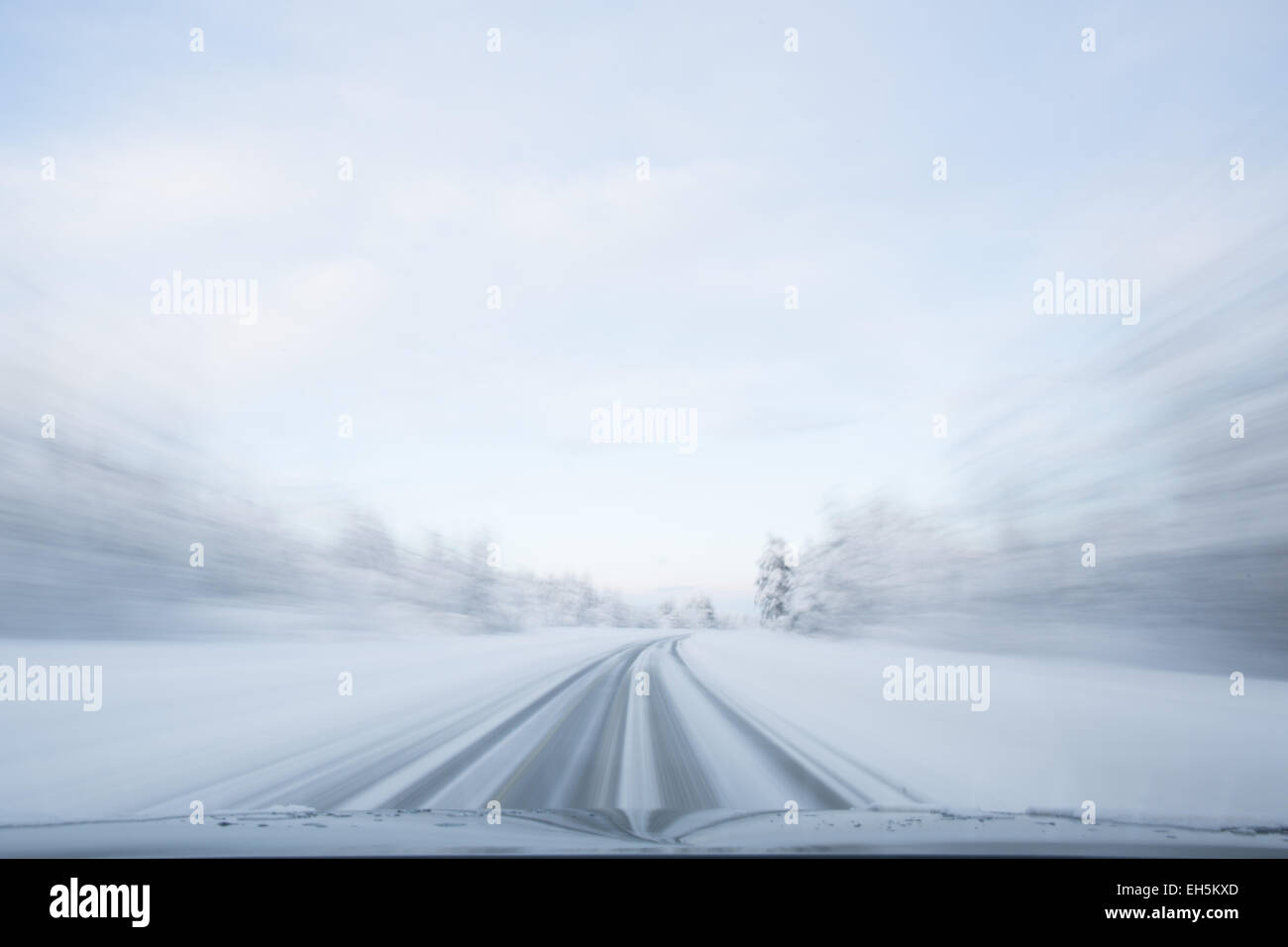 Snowy road scene in Lapland Stock Photo - Alamy