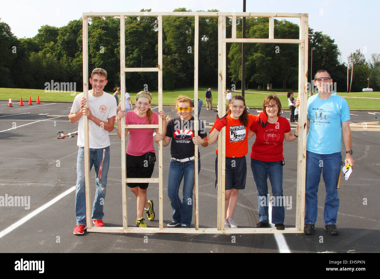 Volunteer people building a house wall panel. Habitat For Humanity ...