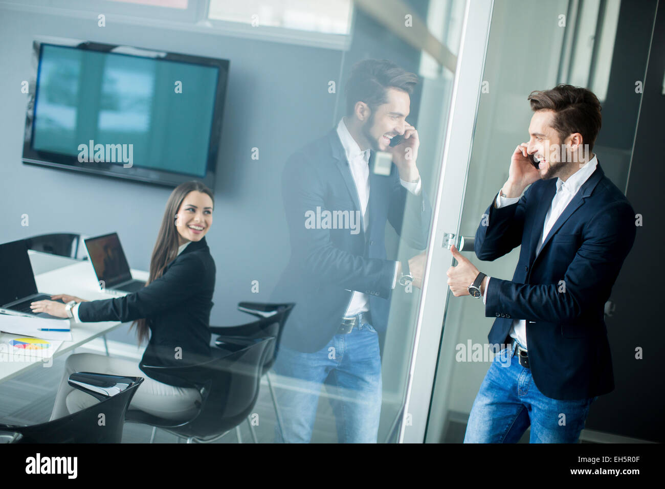 Man looking at mobile phone at work hi-res stock photography and images ...