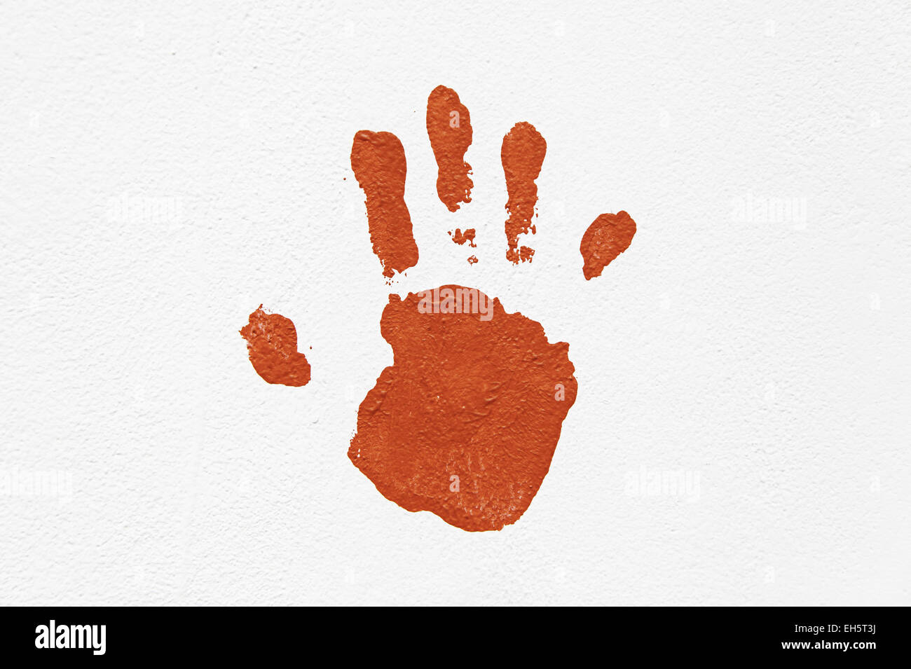 Hand painted on the wall, detail of a hand painted red textured ...