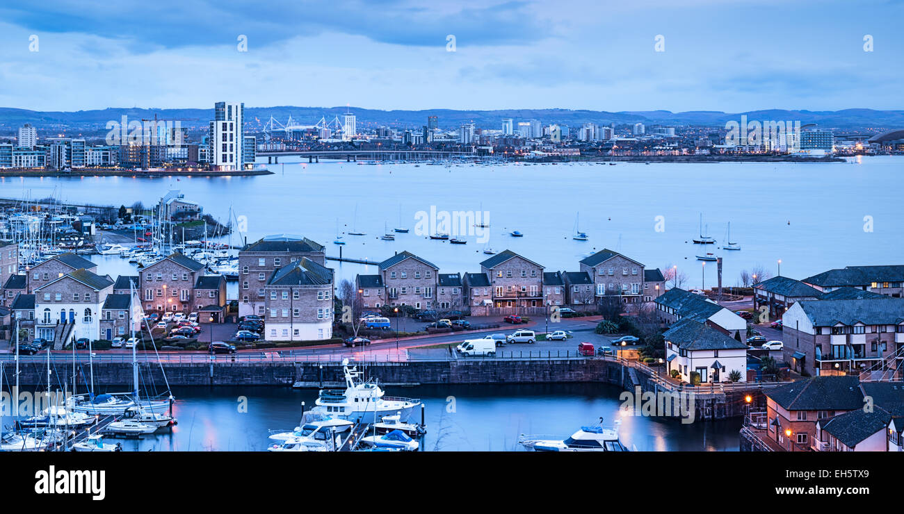 Cardiff Bay in the early hours of the day. Yachts and housing can be ...