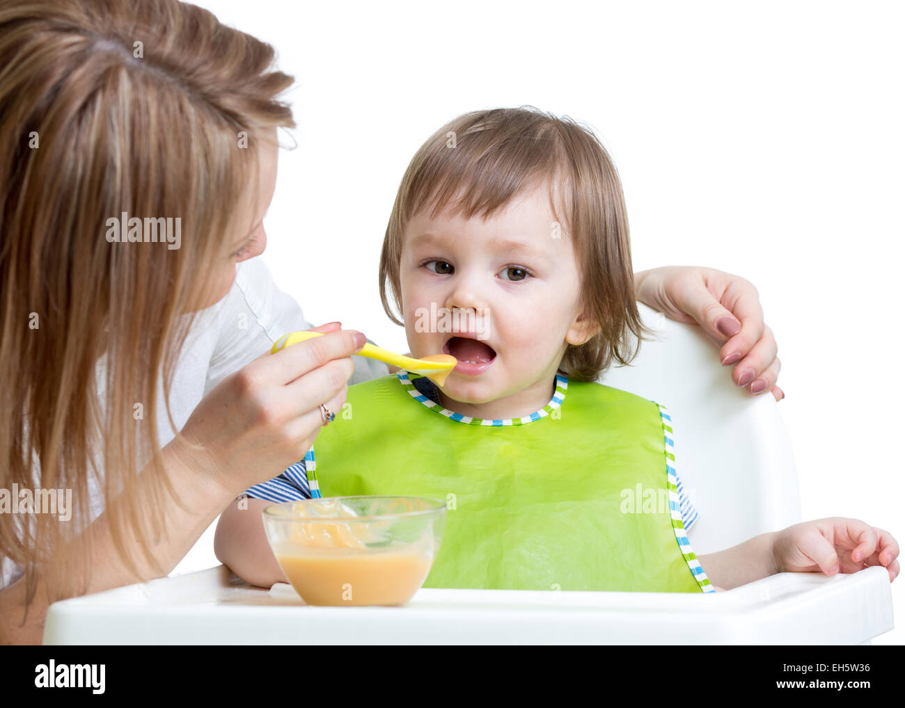 kid eating food on kitchen Stock Photo - Alamy
