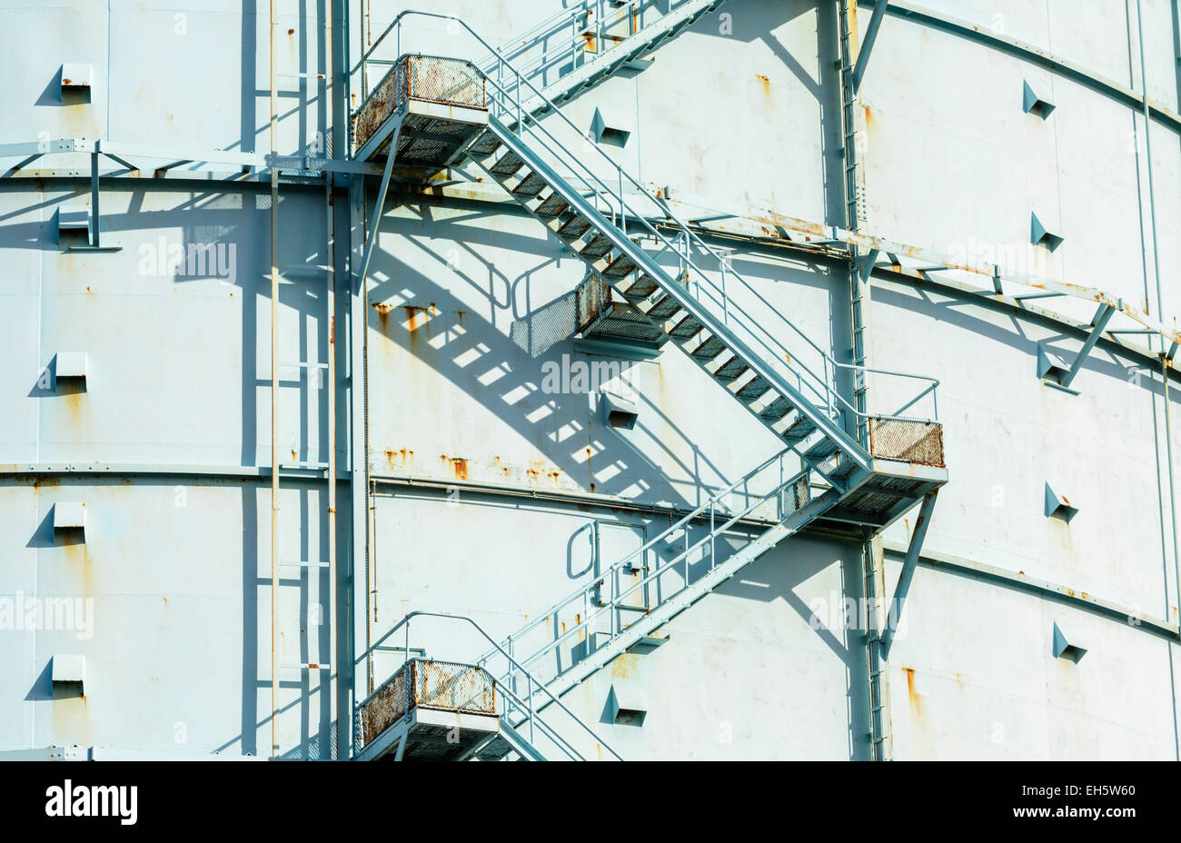 Stairway on the side of a large circular gasometer Stock Photo - Alamy