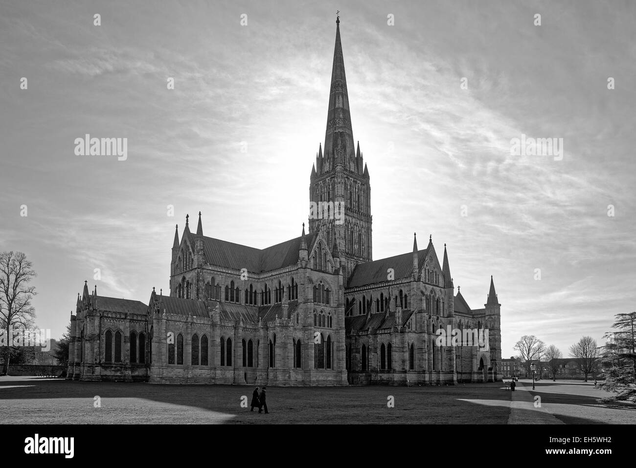 Salisbury Diocese Cathedral in monochrome. Two figures cross in front ...