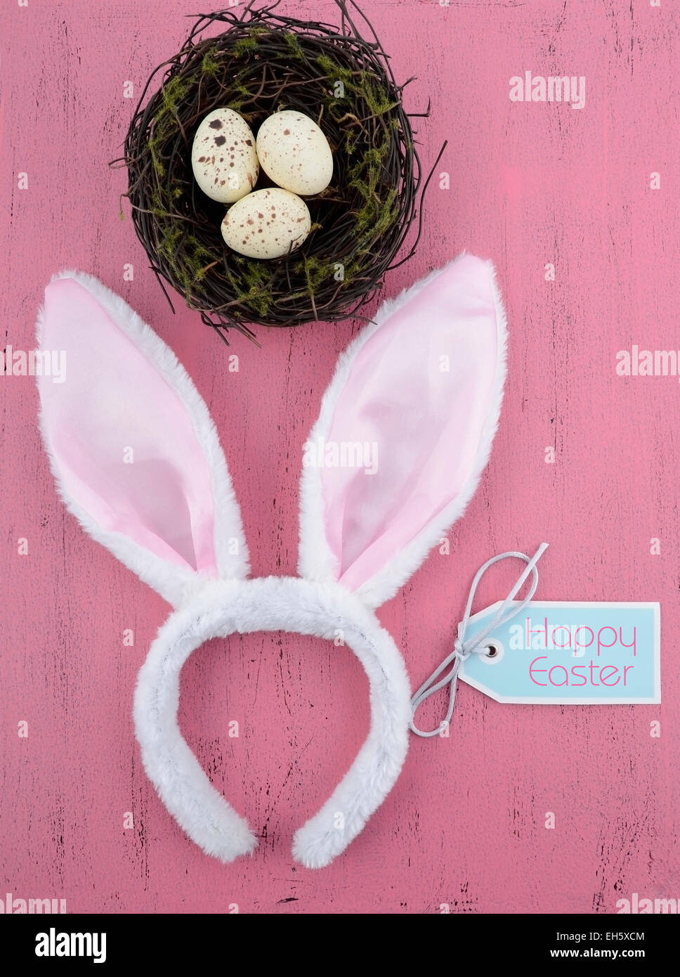 Happy Easter bunny ears with Easter eggs on pink wood background Stock ...