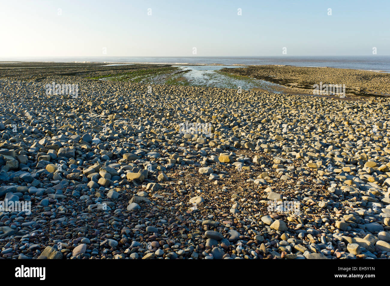 Stones and slabs at low tide on Lilstock beach, Somerset Stock Photo ...