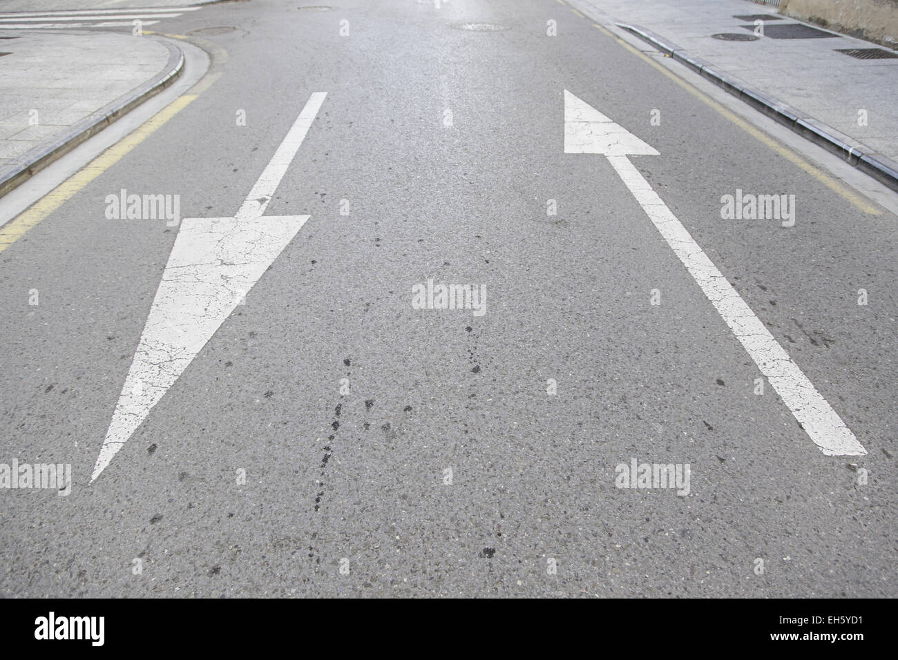 Direction arrows on asphalt, signs of circulation on a road Stock Photo ...