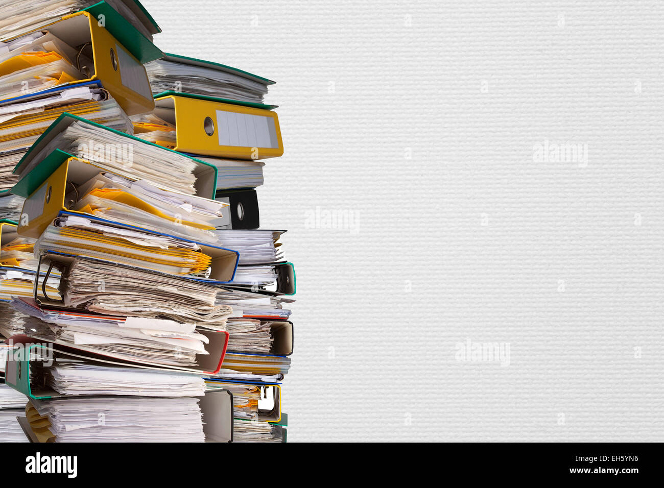 piles of file binder with documents on white paper background Stock ...