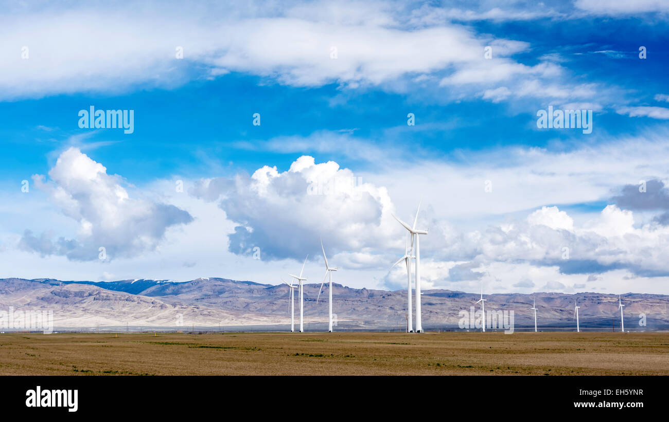 Wind turbines against a dramatic cloudy sky Stock Photo - Alamy