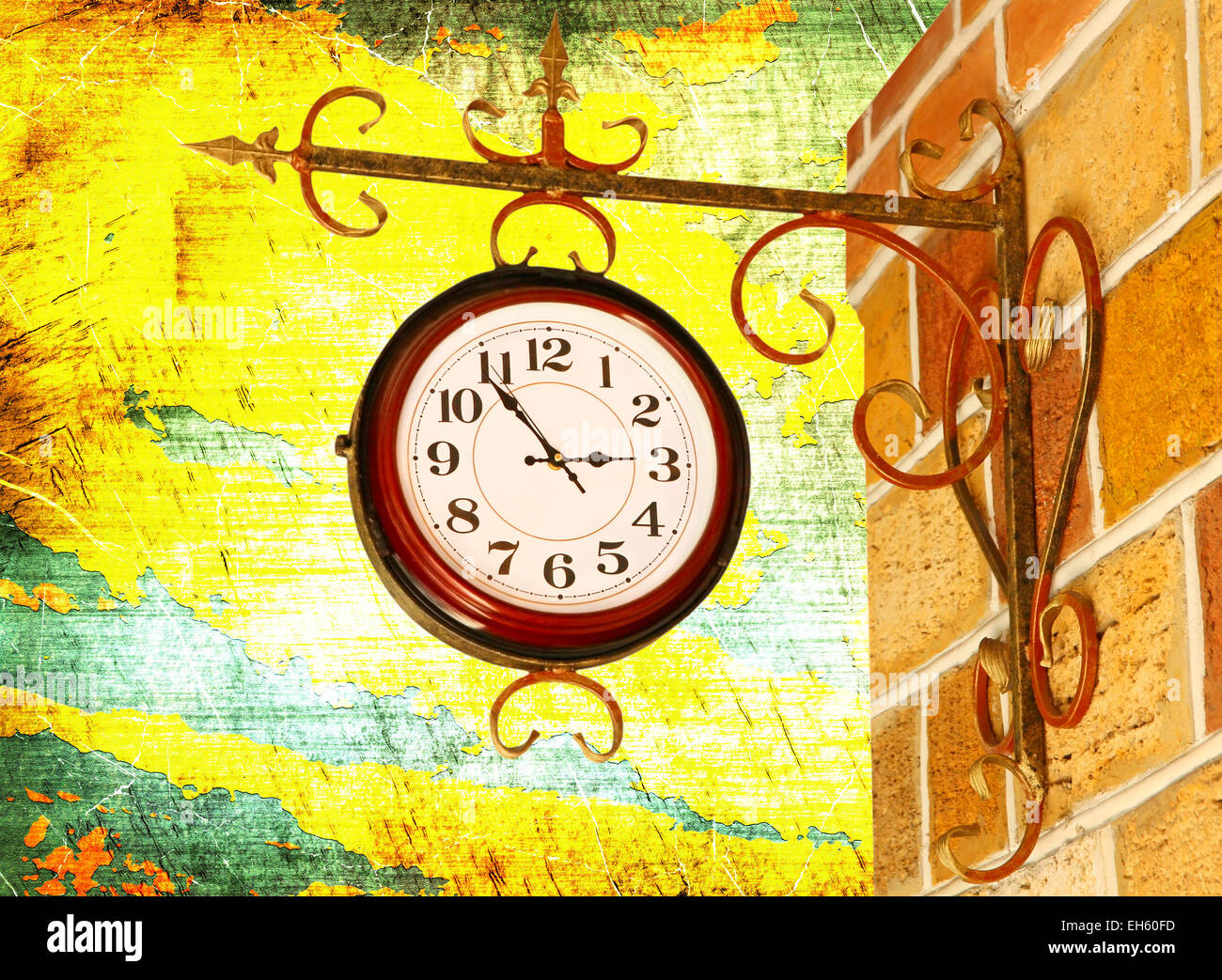 Vintage watch and brick wall on yellow messy background Stock Photo - Alamy