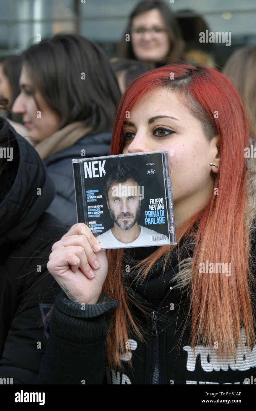 A fan showing her copy of Nek's latest album. The singer meets fans at ...