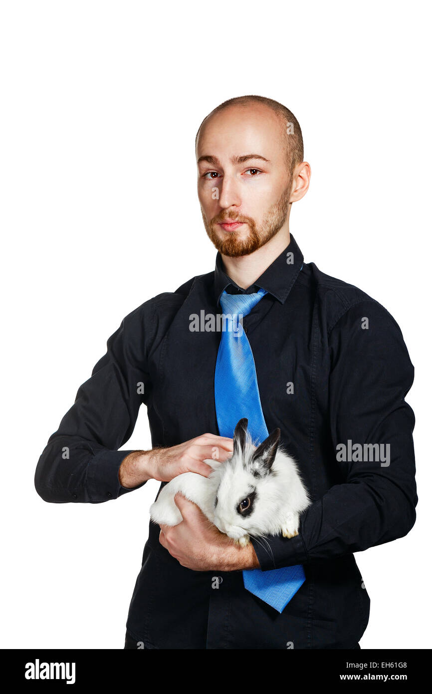 Businessman holding a rabbit, isolated on white background. Business ...