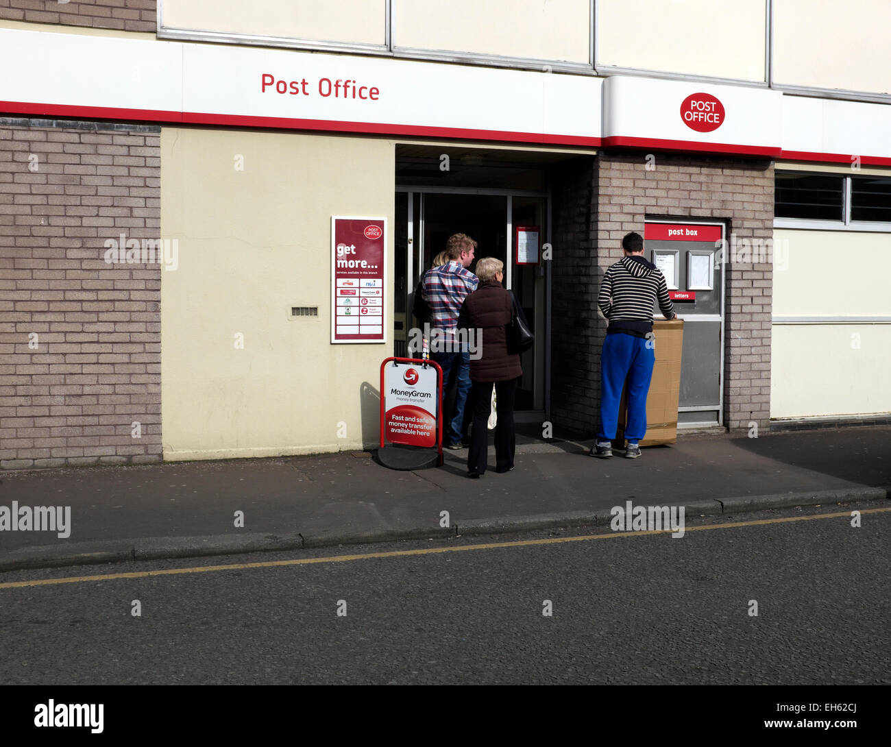 queue outside the post office in didsbury, south manchester Stock Photo ...