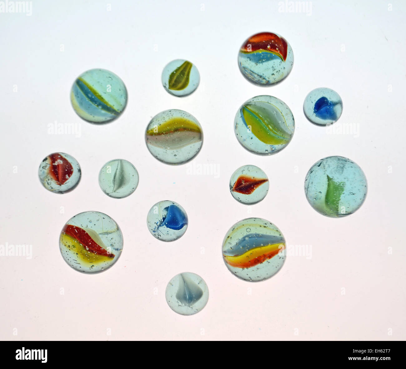 Marbles on a white background Stock Photo - Alamy