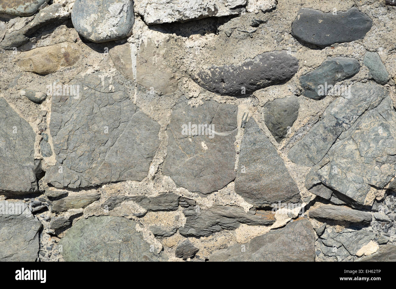 Detail of a vintage stone wall as a background image Stock Photo - Alamy