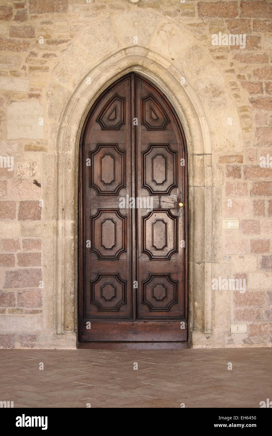 Medieval front door in Assisi, Italy Stock Photo - Alamy