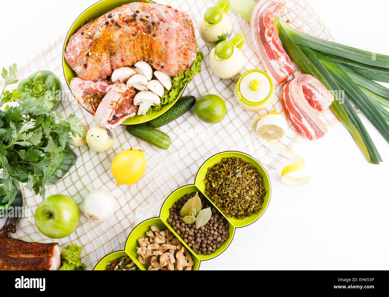 Smoked bacon pork meat with green healthy salad and various herbs on ...