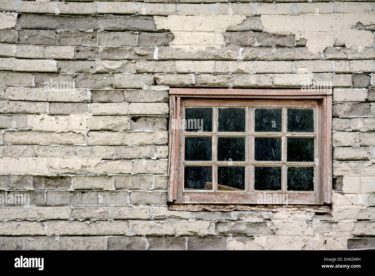 Mud brick building and glass window Stock Photo - Alamy