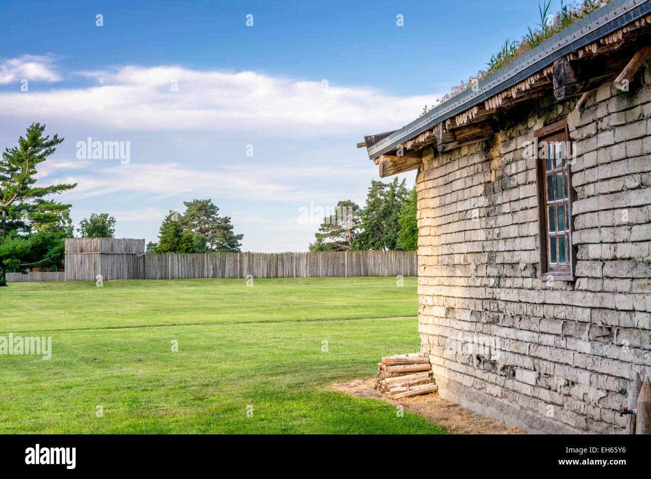 Rustic old building in Nebraska with log fence Stock Photo - Alamy