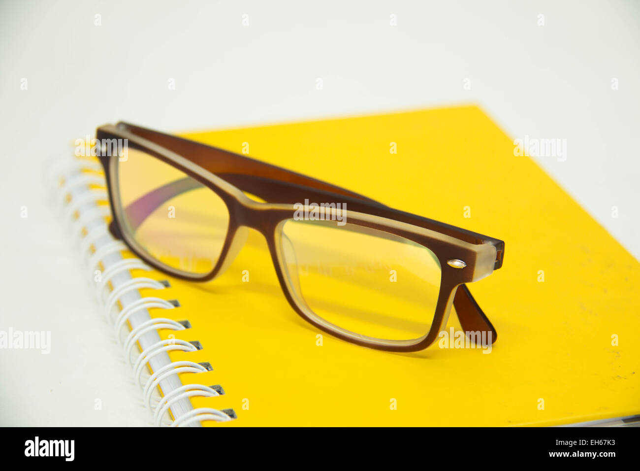 writing pen ready for taking notes on a notebook paper glasses over ...